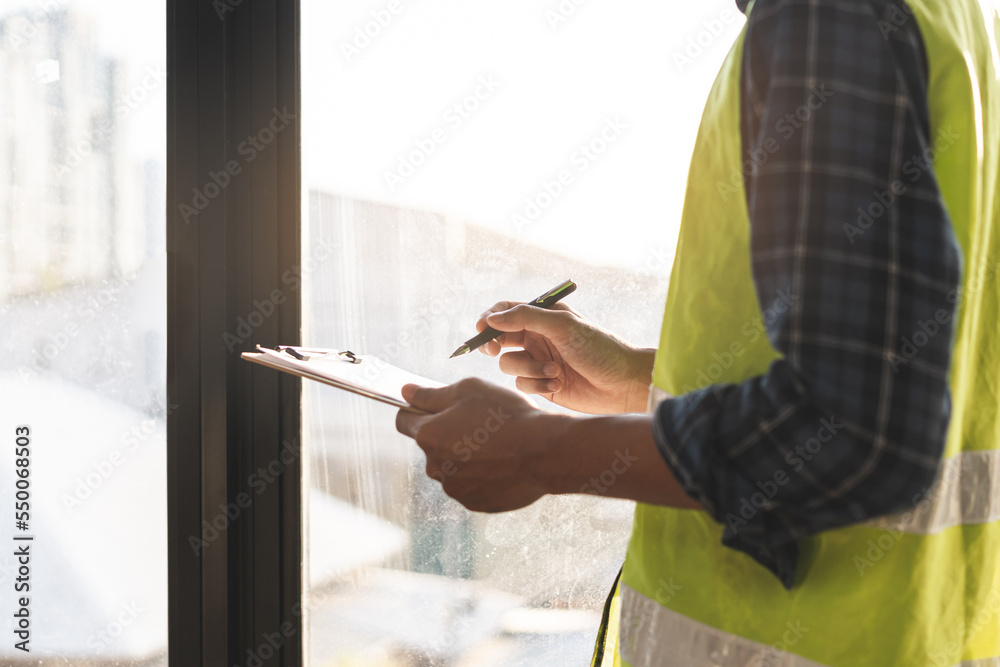 Building inspection, asian contractor young man, male inspecting home ...