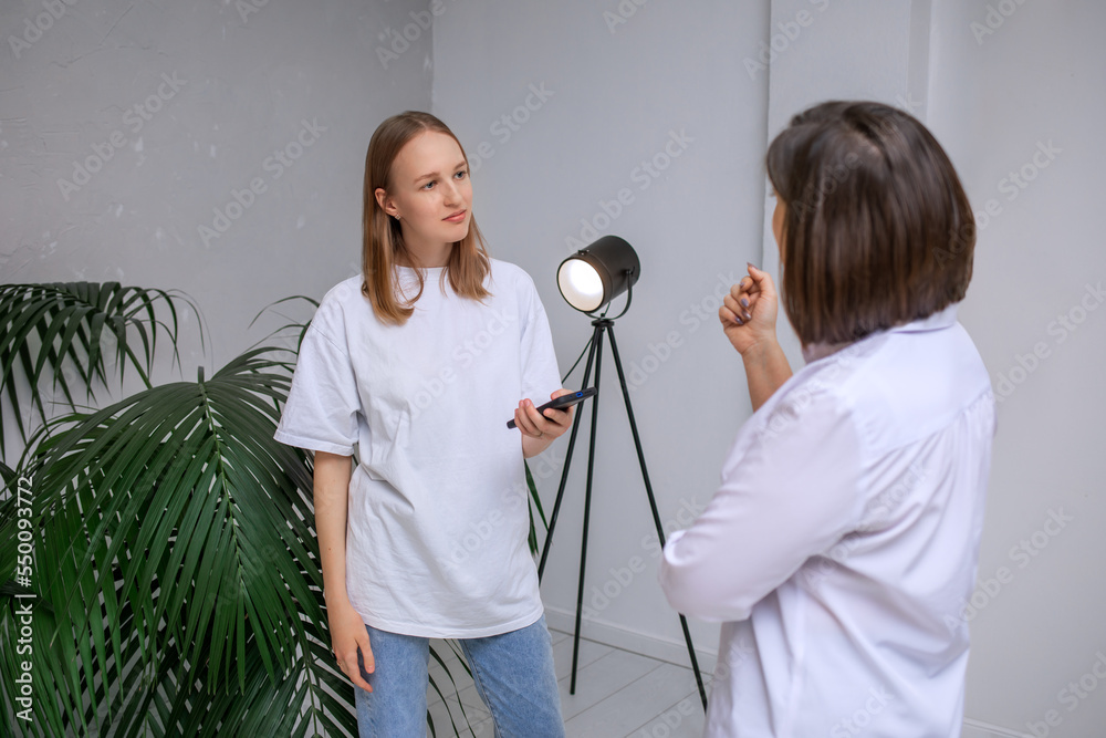 Moment of an interview with a young journalist. A conversation between ...