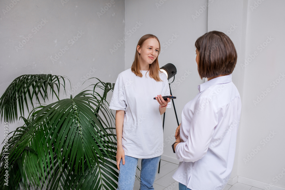 Moment of an interview with a young journalist. A conversation between ...