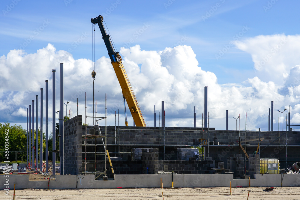 Construction site of a new industrial building with vertical steel ...