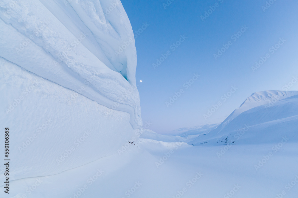 View up windswept snow banks in Foxdalen, Svalbard. Stock Photo | Adobe ...