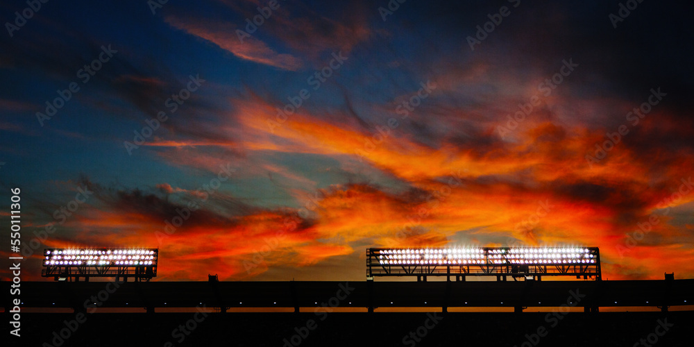 Stadium lights at sunset. Stock Photo | Adobe Stock