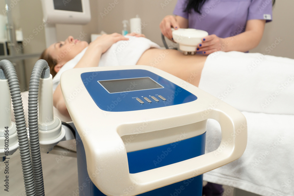 Cosmetologist doing radio frequency lift for skin laxity treatment ...