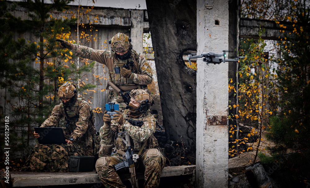 Military soldier controls drone for reconnaissance operation of enemy ...