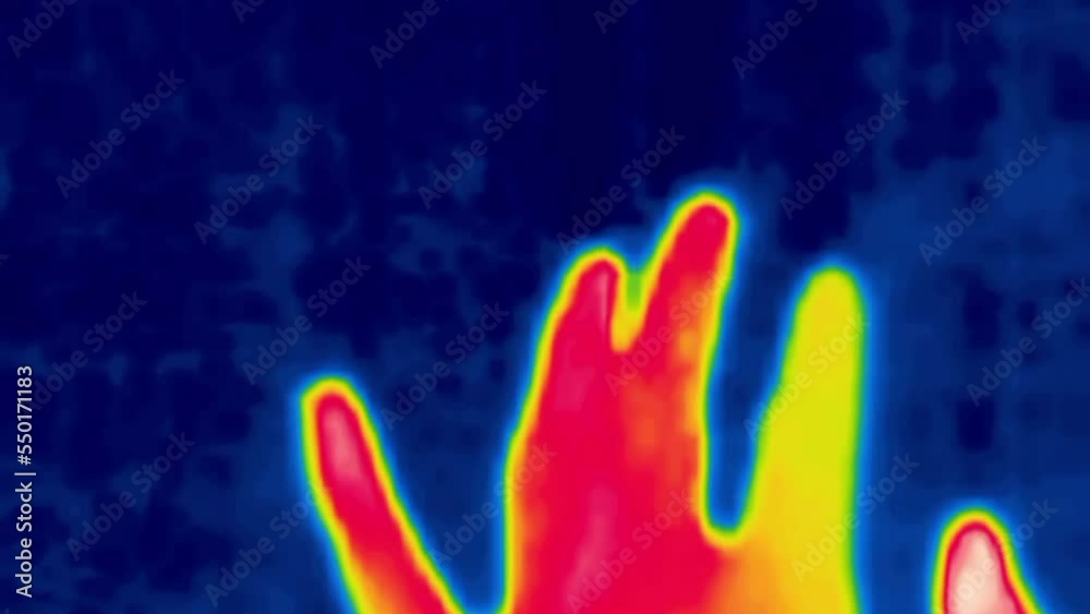 Hand gestures captured on thermal imager device. Warm hands of an ...
