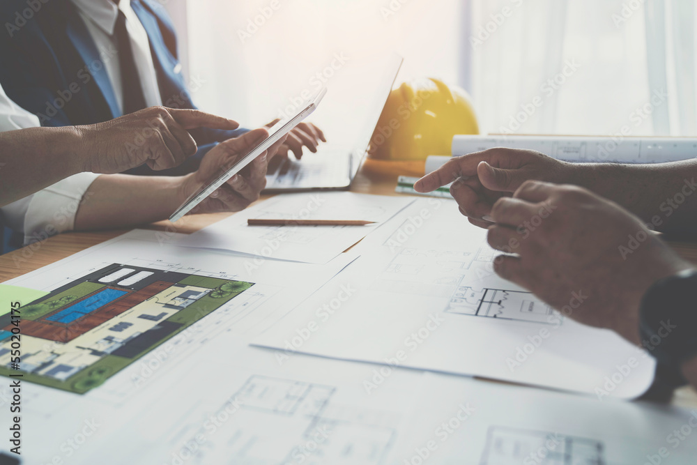 Businessman and architect meeting for planing and checking house design ...