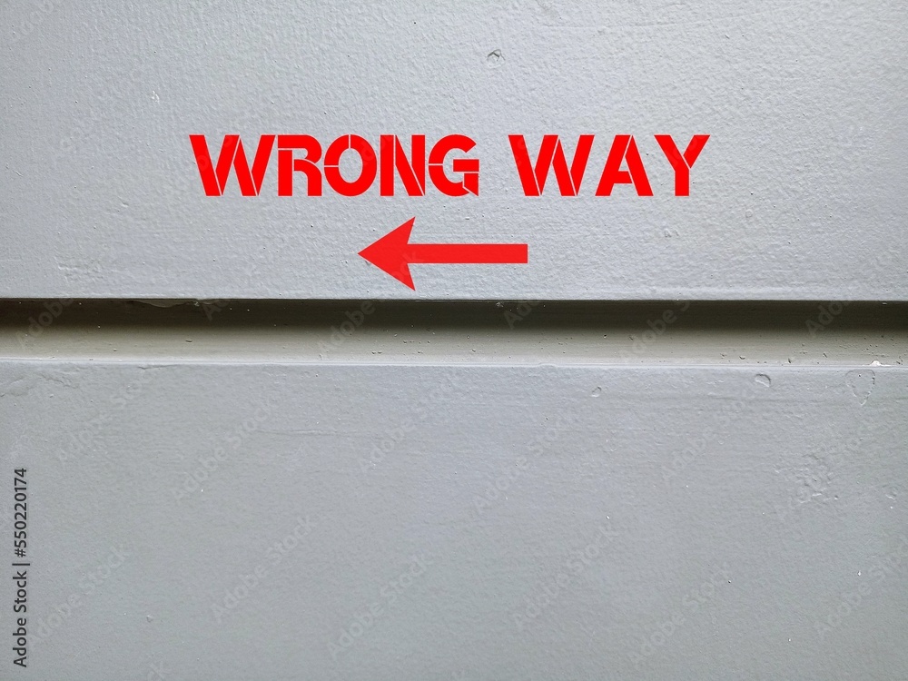 Copy space wall with text inscription and sign to WRONG WAY, concept of ...