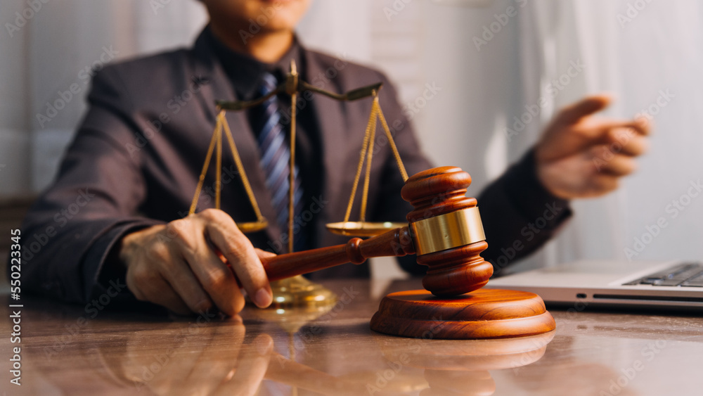 Justice and law concept.Male judge in a courtroom with the gavel ...