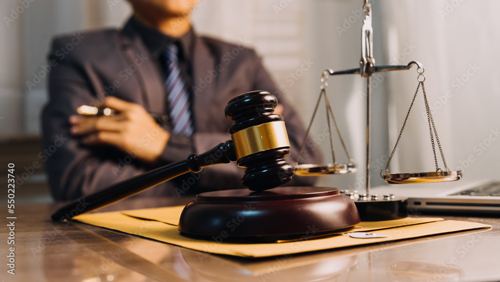 Justice and law concept.Male judge in a courtroom with the gavel ...