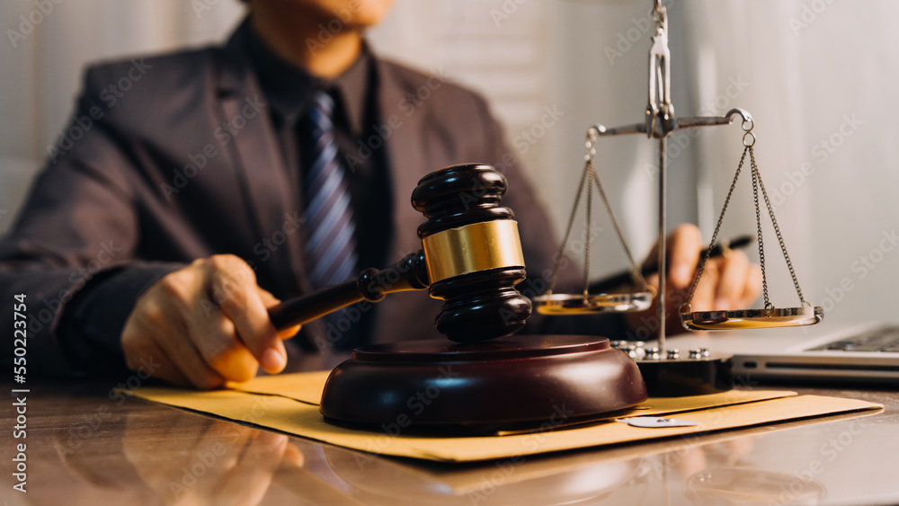 Justice and law concept.Male judge in a courtroom with the gavel ...