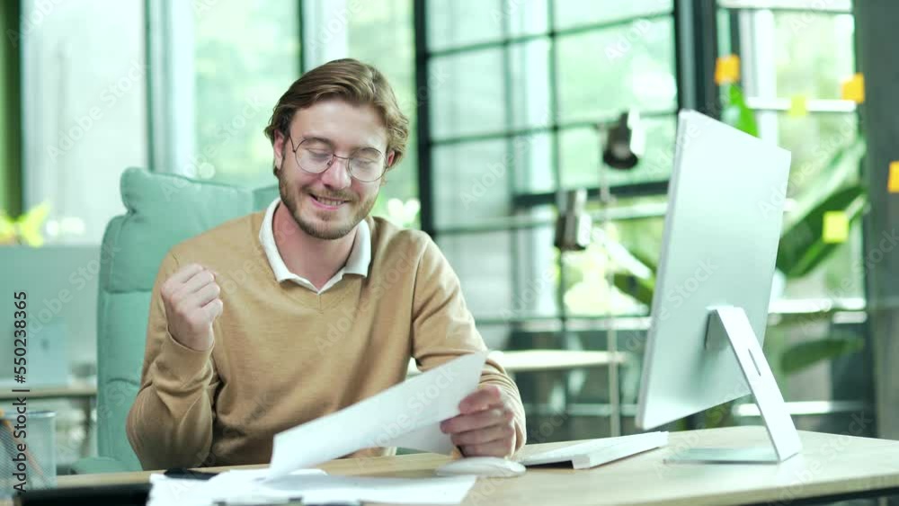 Happy young business man office worker with glasses reading mail work ...