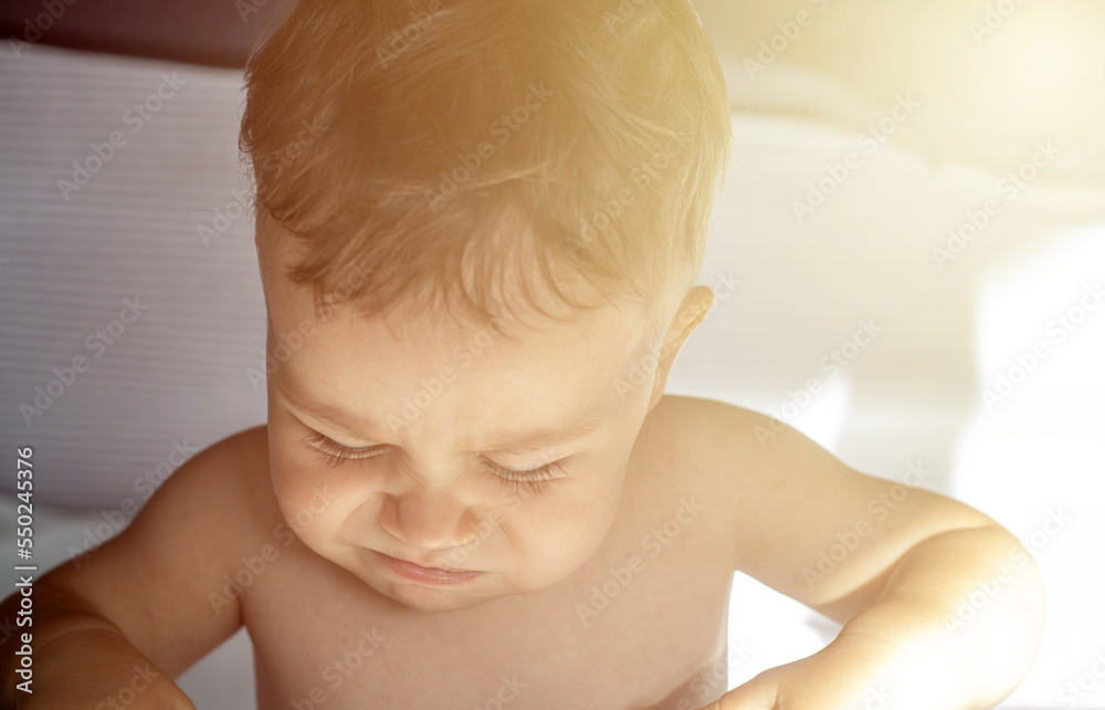 upset dissatisfied angry baby boy child kid in baby crib refuse to stay ...