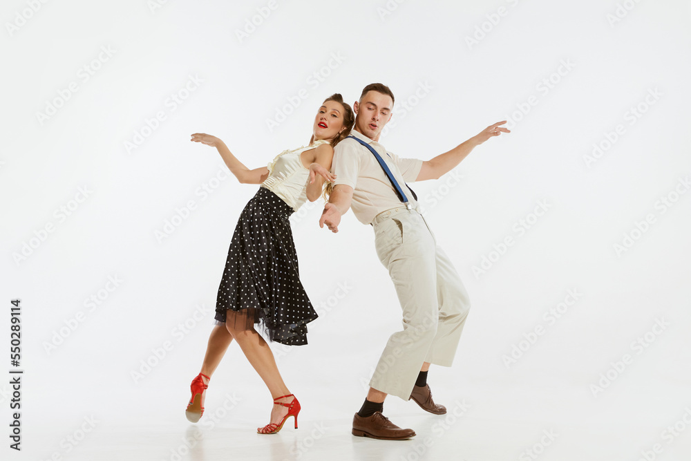 Young excited man and woman in 60s american fashion style clothes ...