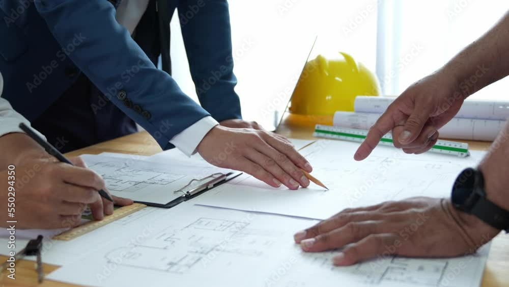 Businessman and architect meeting for planing and checking house design ...