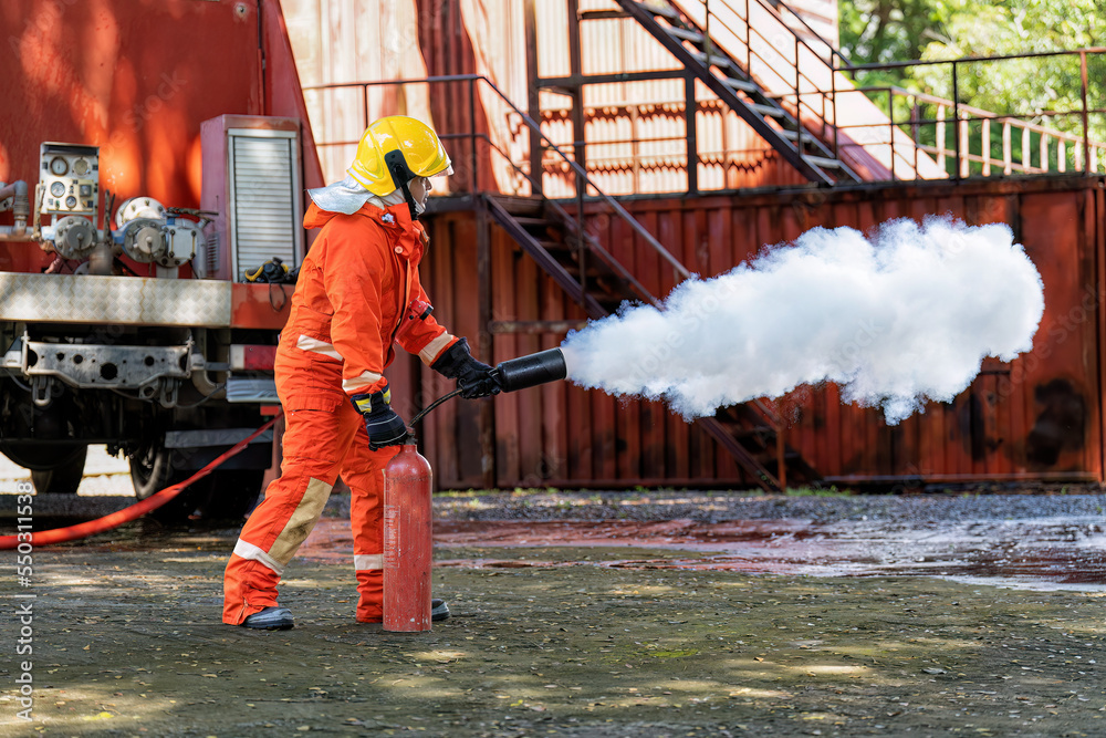 Fireman wearing fire protection suite and oxygen tank exercise hold ...