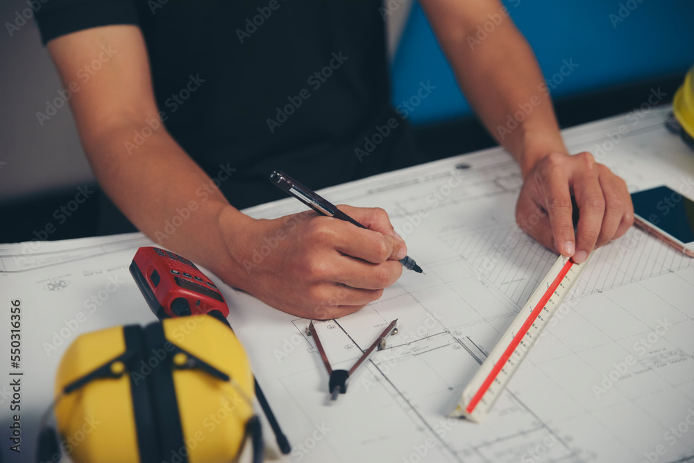 Engineer hand inspector and checklist blueprint on construction site ...