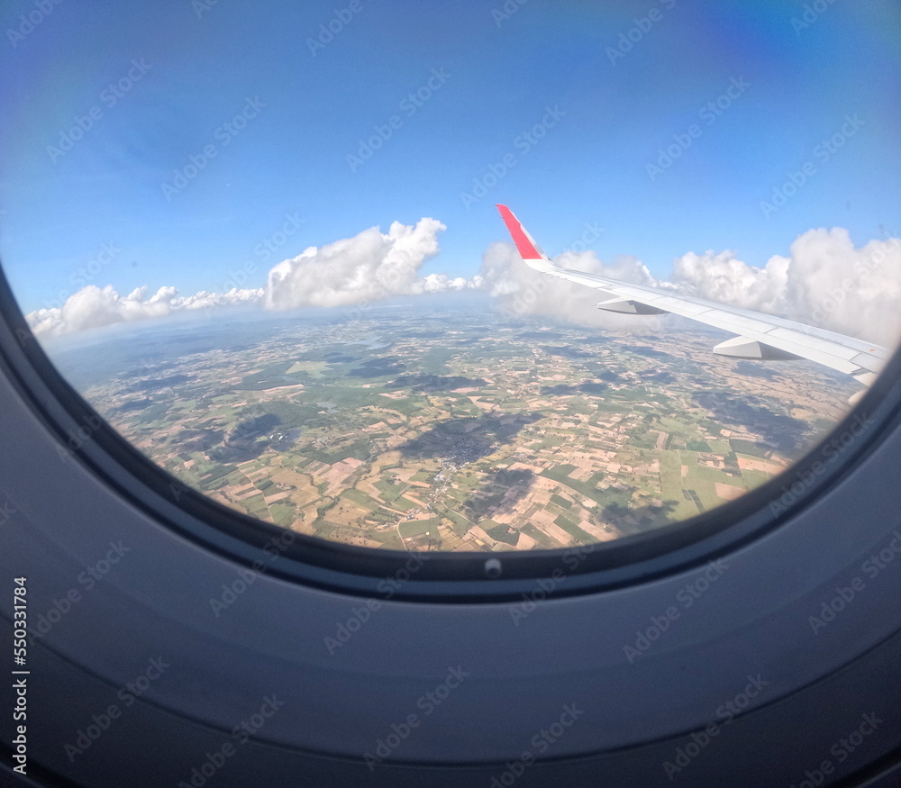 Looking through window aircraft, You can see the tip of the plane's ...