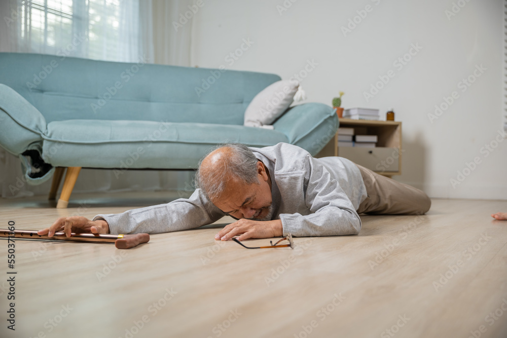 Older senior man headache lying on the floor after falling down he pain ...