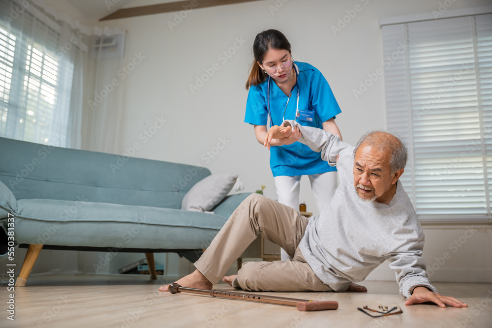 Asian older senior man falling down on lying floor and woman nurse came ...