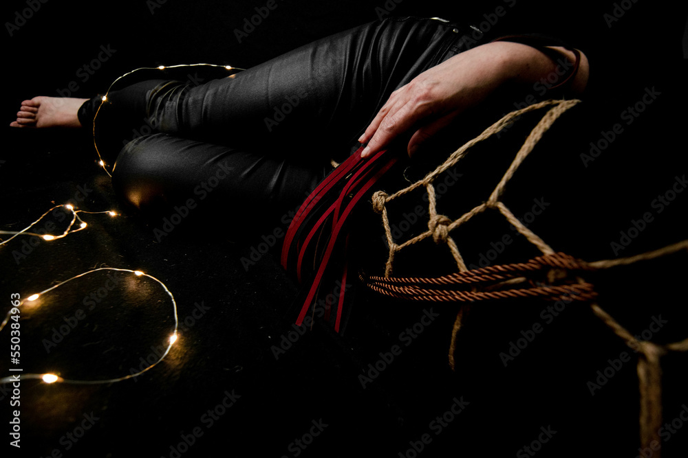 Woman with a Leg tied on a futomomo knot and a karada knot on her chest ...