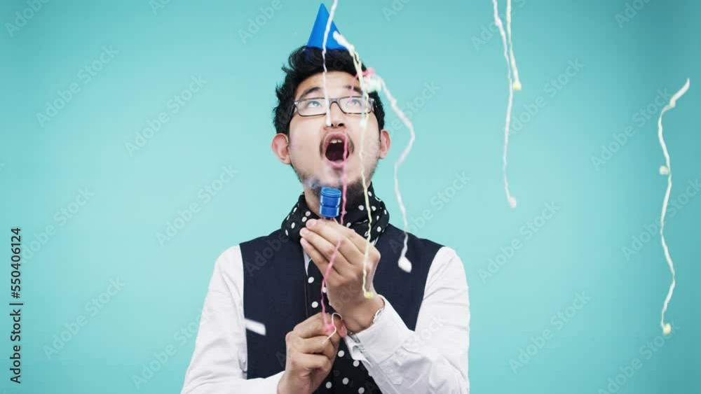 Asian man, party popper and birthday hat while surprised, shocked and ...