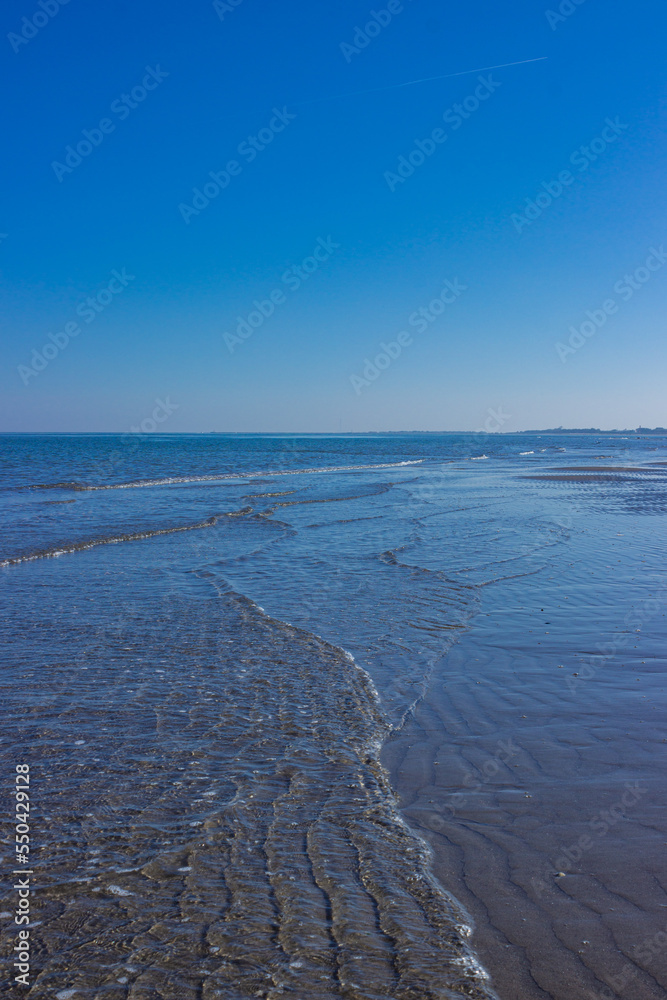 Beautiful seascape. Low tide in Porto Caleri, Rosolina, Italy. Vertical ...