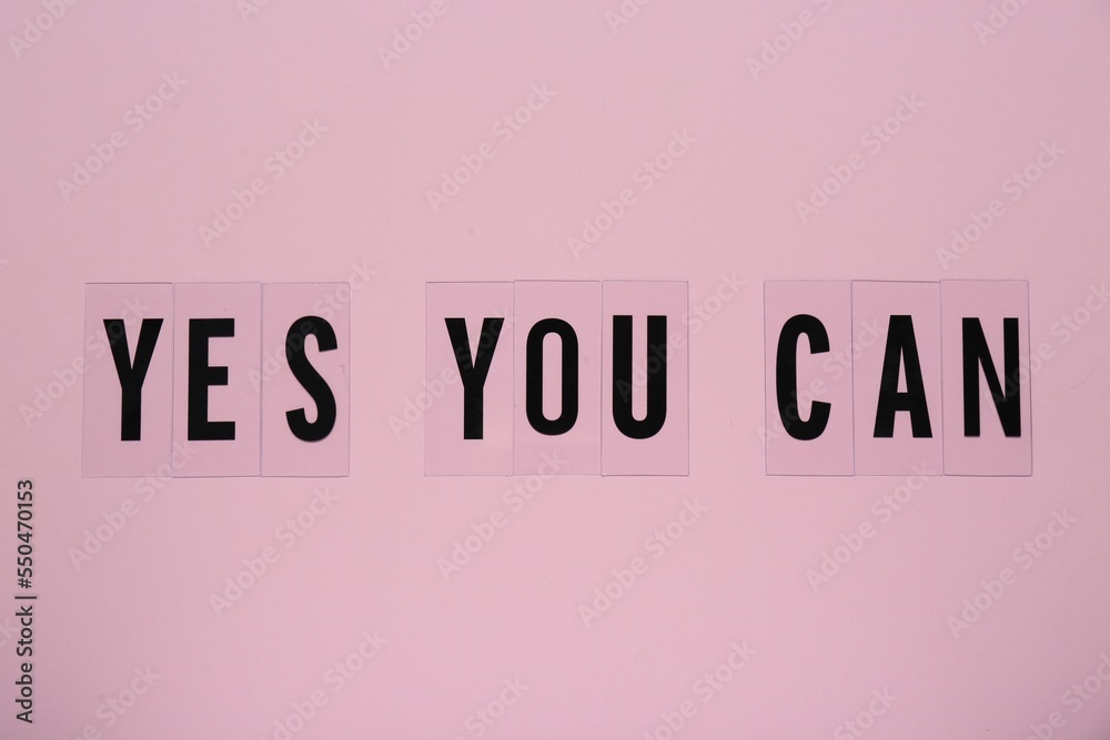 Phrase Yes You Can of plastic letters on pink background, top view ...