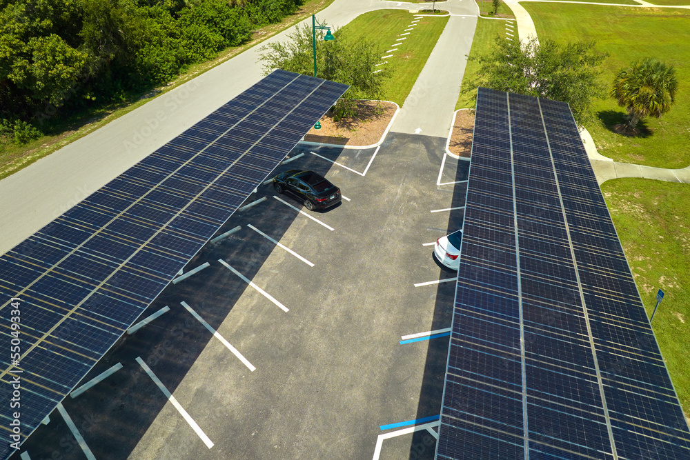 Solar panels installed over parking lot for parked cars for effective ...
