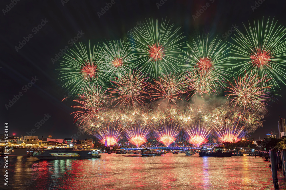 Beautiful fireworks and iconic Bangkok landmarks are illuminated by ...