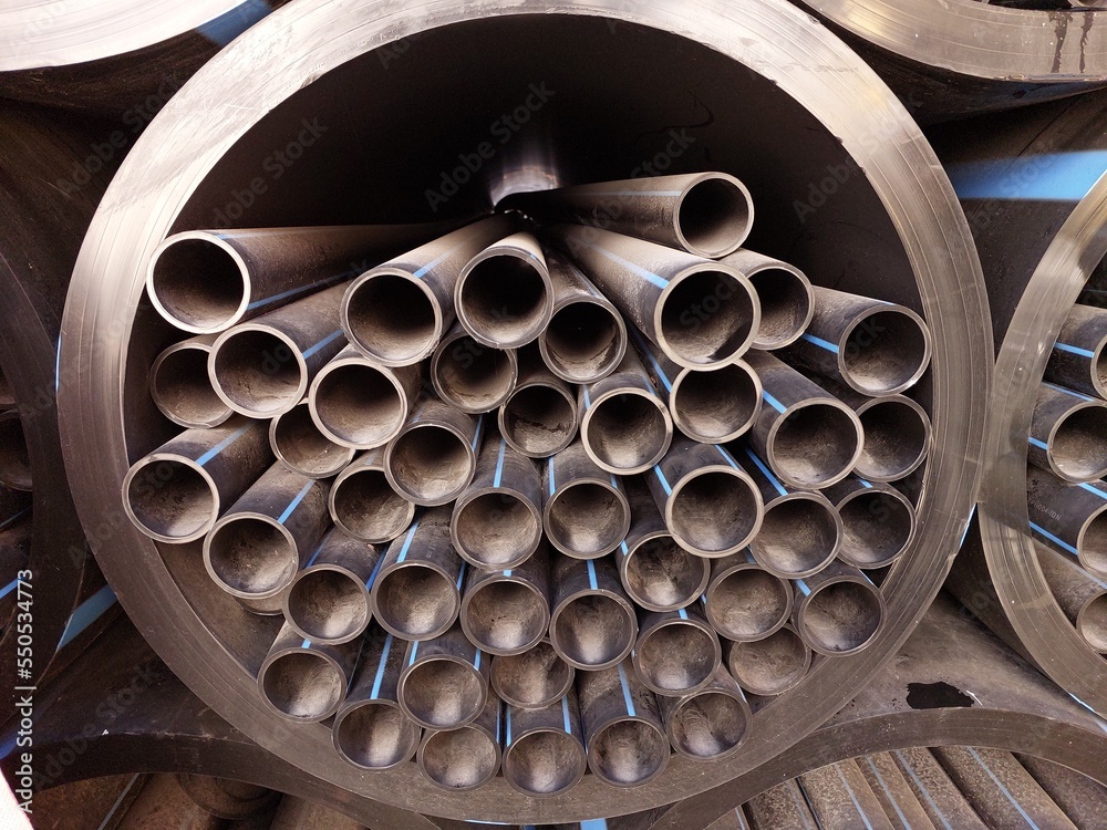 Foto de The stack of HDPE (high density polyethylene) pipes shot close ...