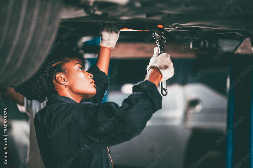 Garage women worker mechanic team working car auto service fix replace ...