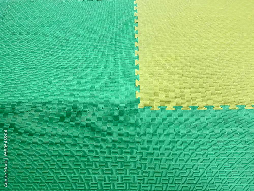 Green and yellow rubber mat for sports and children's playground Stock ...