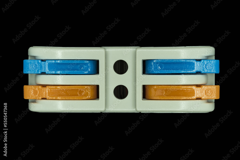 Compact splicing connector isolated on black background. Stock Photo ...
