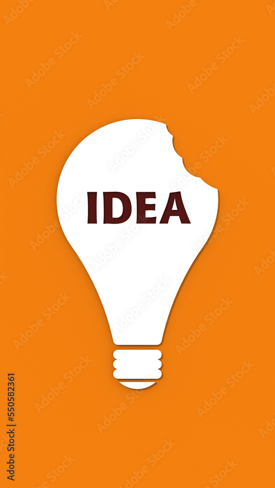 a white bitten light bulb with the inscription idea on a orange ...