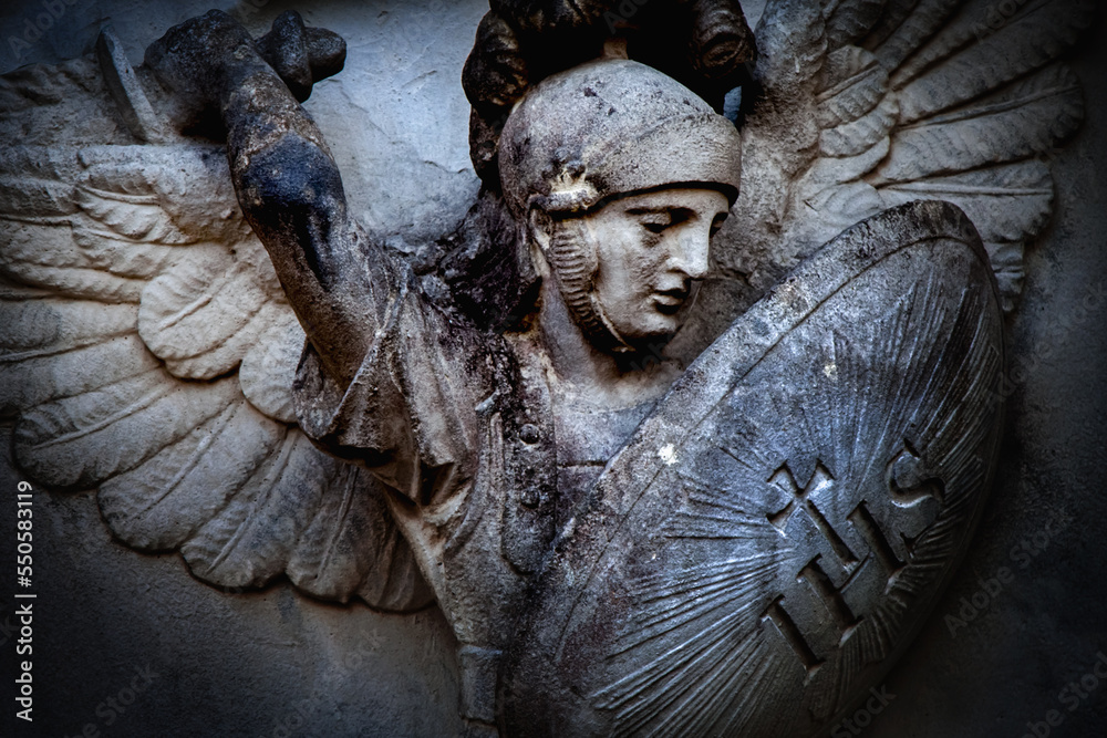 Saint Michael struggles with evil. Fragment of antique statue. Good ...