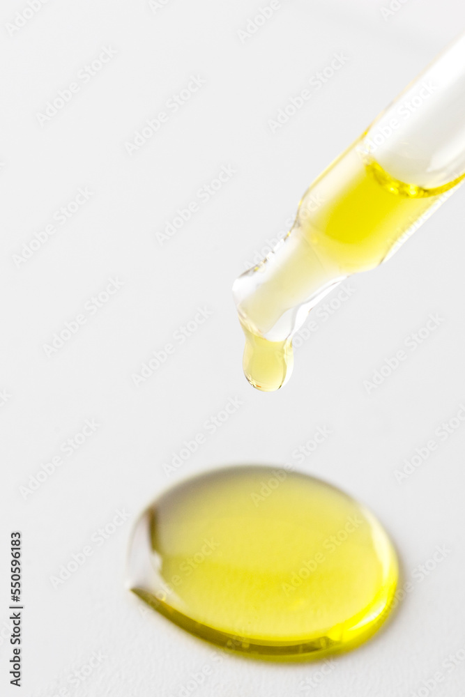 Cosmetic pipette with serum smear smudge drop swatch of collagen and ...