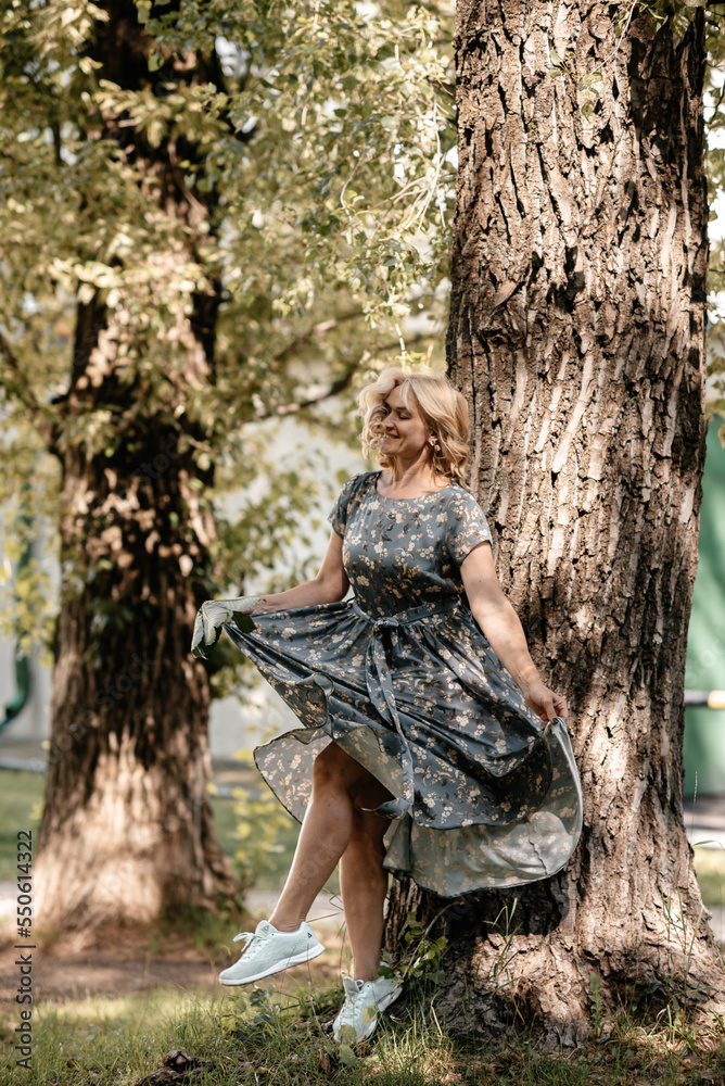 A girl with long blond hair walking in the park ran into a beautiful ...
