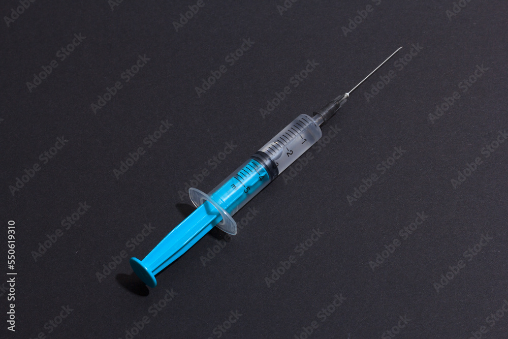 Disposable plastic syringe prepared for injection and vaccination in ...