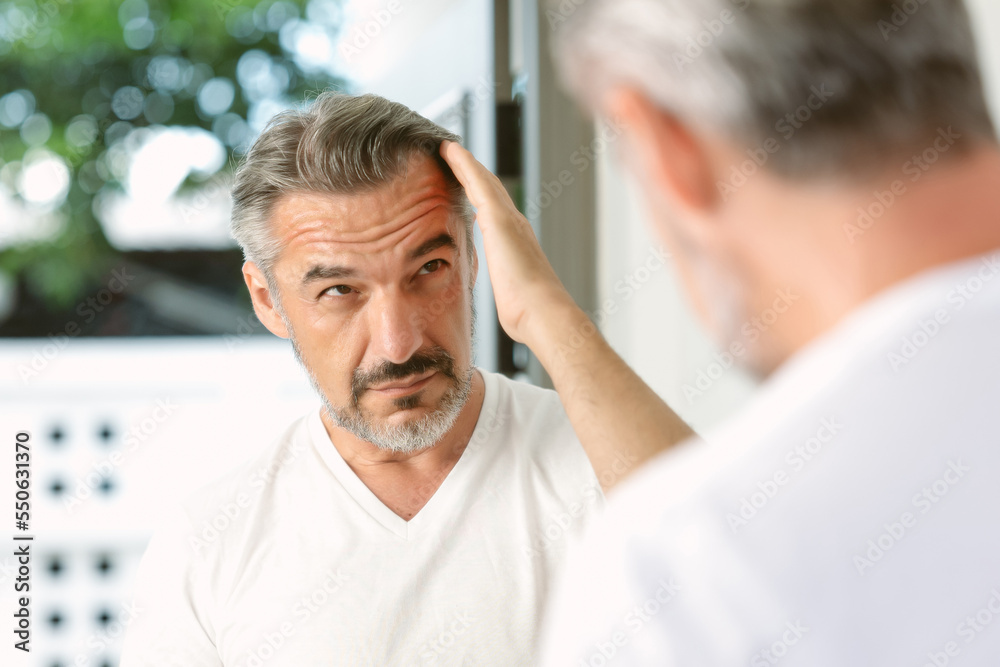 Handsome Middle Age Caucasian Man With Beard Looks In The Mirror Middle Aged Man Concerned By