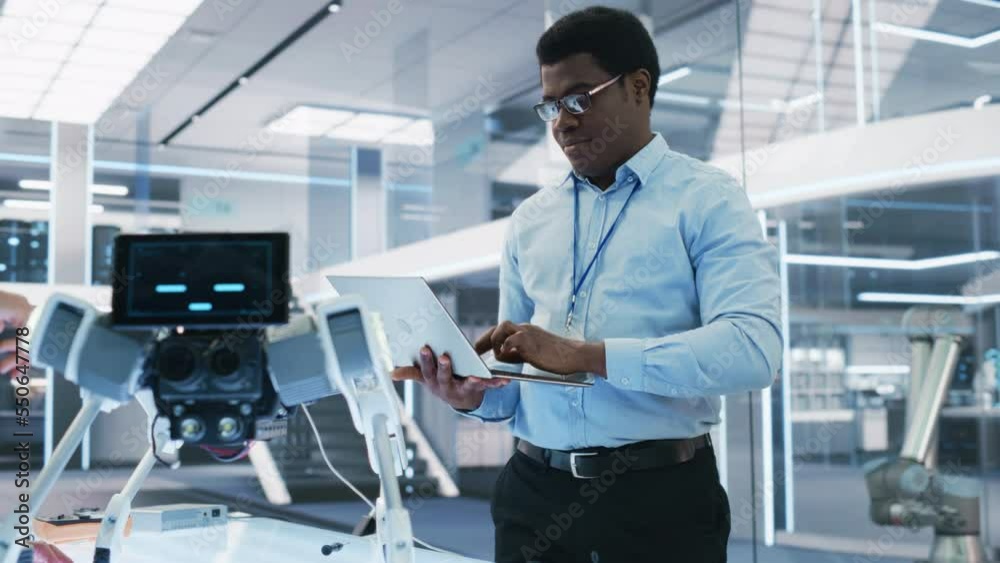 Portrait of a Handsome Young Black Multiethnic Engineer Programming ...