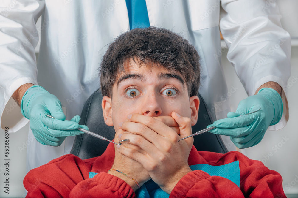scared patient at the dentist Stock Photo | Adobe Stock