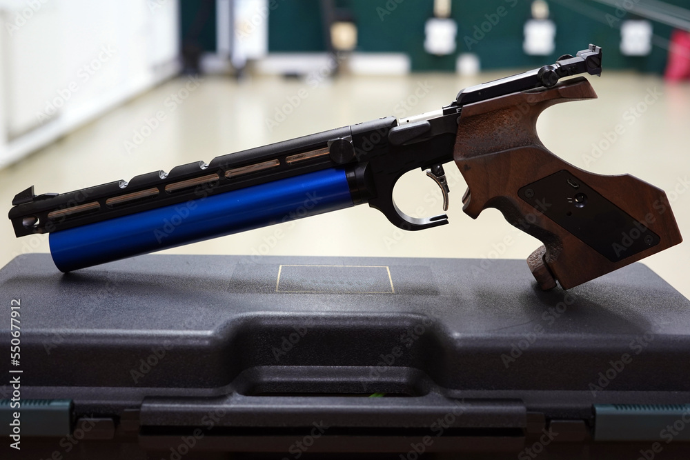 Sports pistol photographed in a shooting range. Stock Photo | Adobe Stock