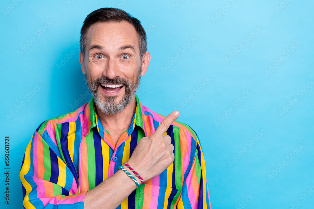 Portrait of funny overjoyed positive mature man grey hair beard finger ...