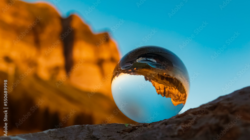 Crystal ball alpine sunset shot with the famous Saentis summit with ...