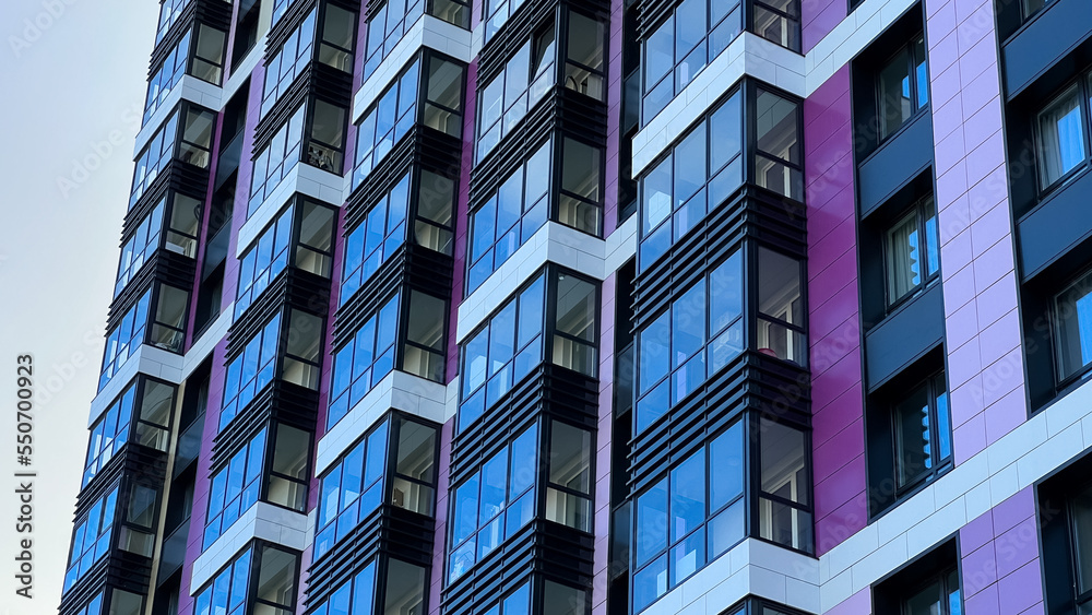 The facade of the building in purple,geometric patterns from windows ...