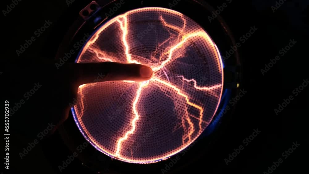 Electric shock waves. Child'd finger touching broken lamp. Power energy ...