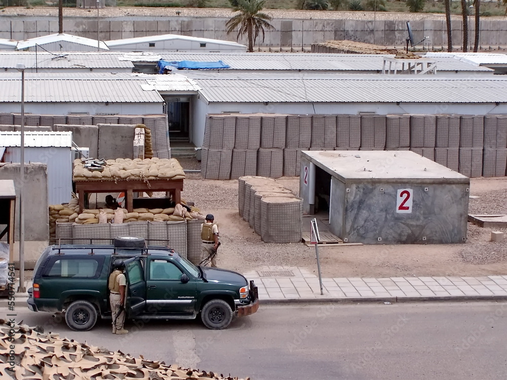 Overhead view of an armored car by a living area surrounded by blast ...