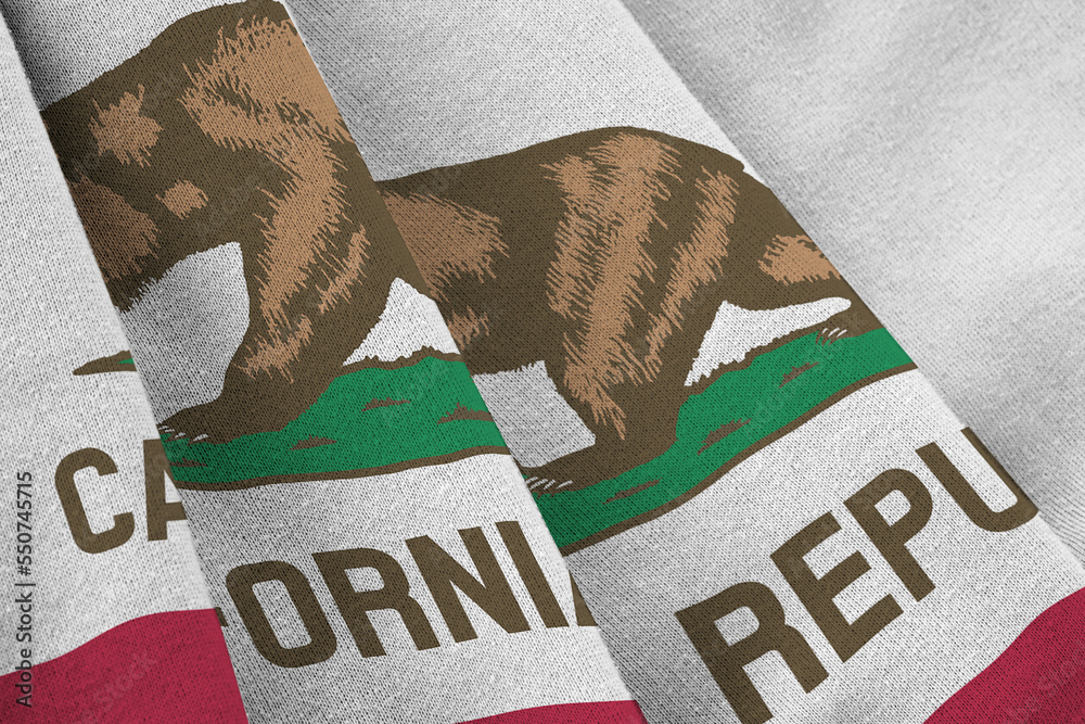 California US state flag with big folds waving close up under the ...