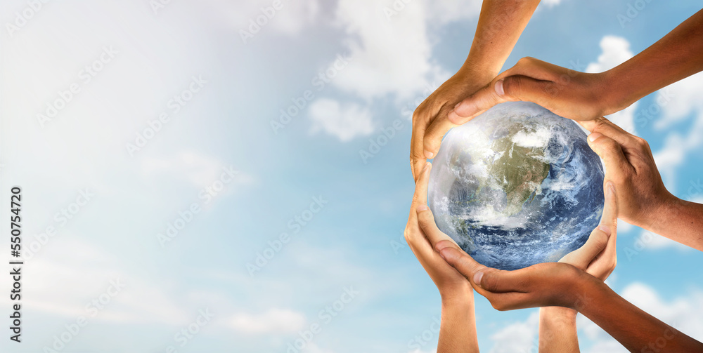 Conceptual symbol of multiracial human hands surrounding the Earth ...