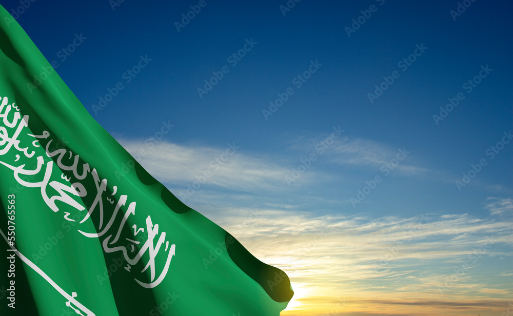 Saudi Arabia flag on sunset or sunrise background Stock Photo | Adobe Stock